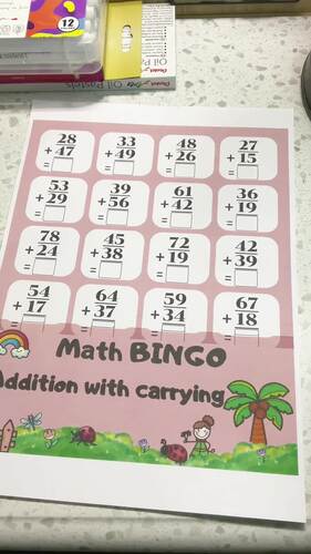 Addition with regrouping bingo by Sparkle & Learn Studio | TPT