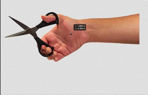 hand holding open scissors